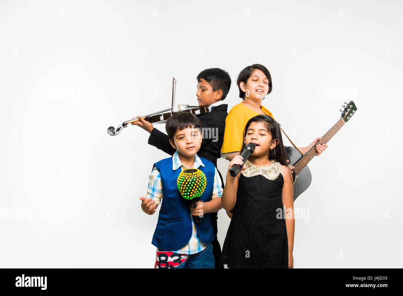 Kids and music concept - Cute little Indian kids playing musical ...