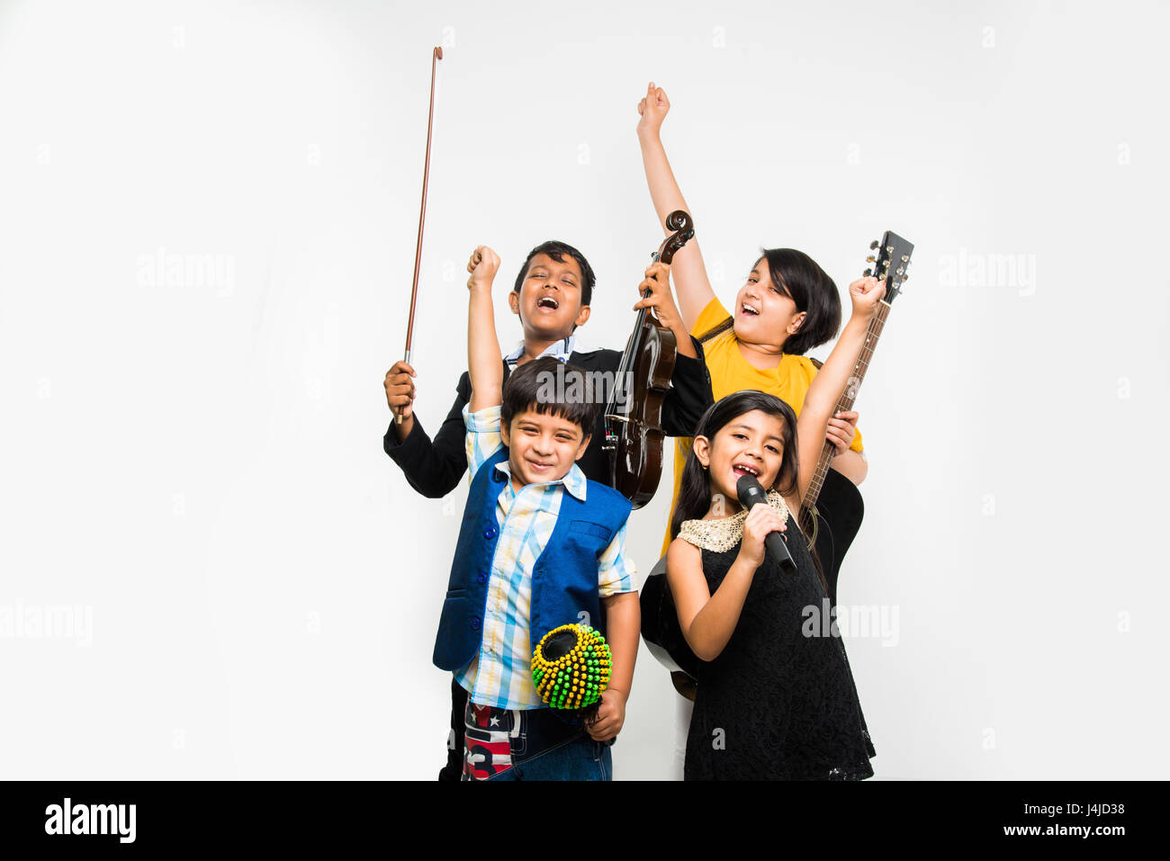 Kids and music concept - Cute little Indian kids playing musical ...