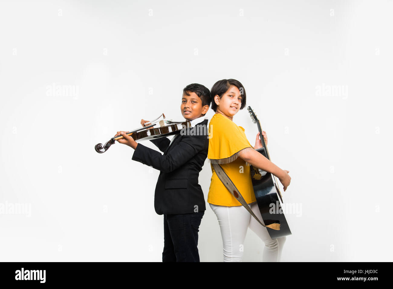 Kids and music concept - Cute little Indian kids playing musical ...