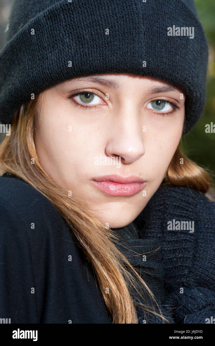 EMILY SAARI wearing winter mittens, scarf and hat close up Stock Photo ...