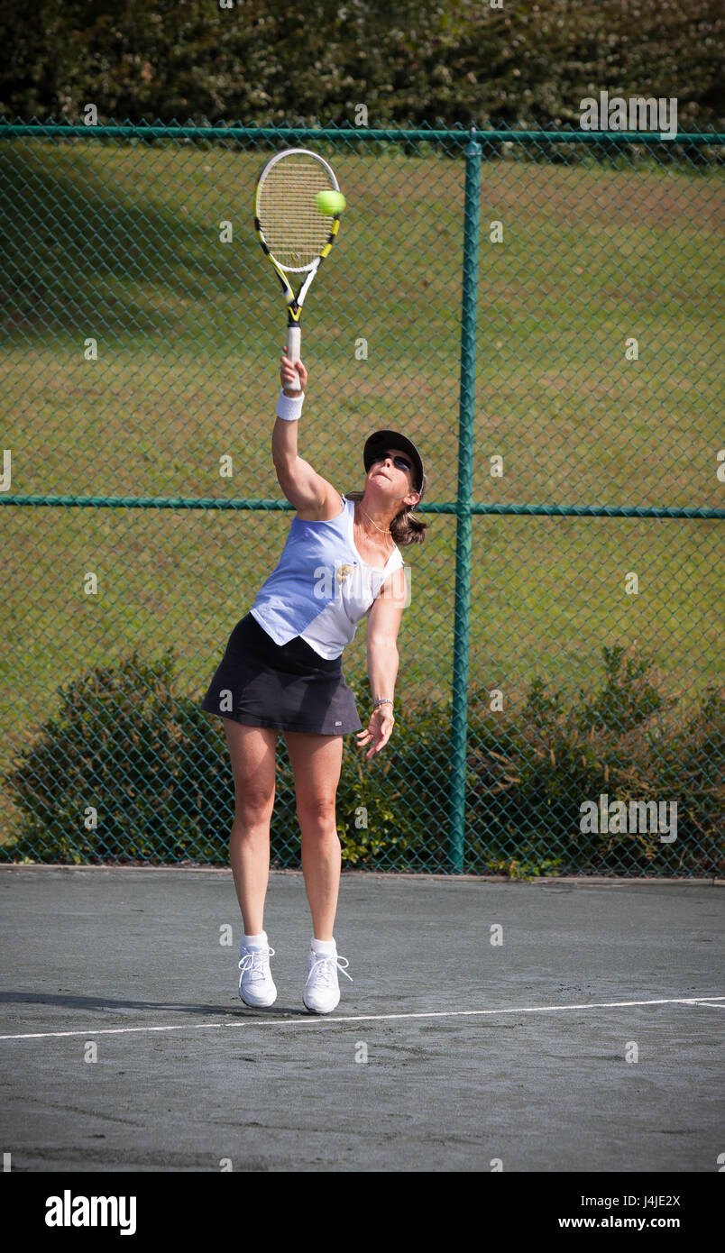 Tennis senior, athlete, female hits backhand volley properly Stock ...