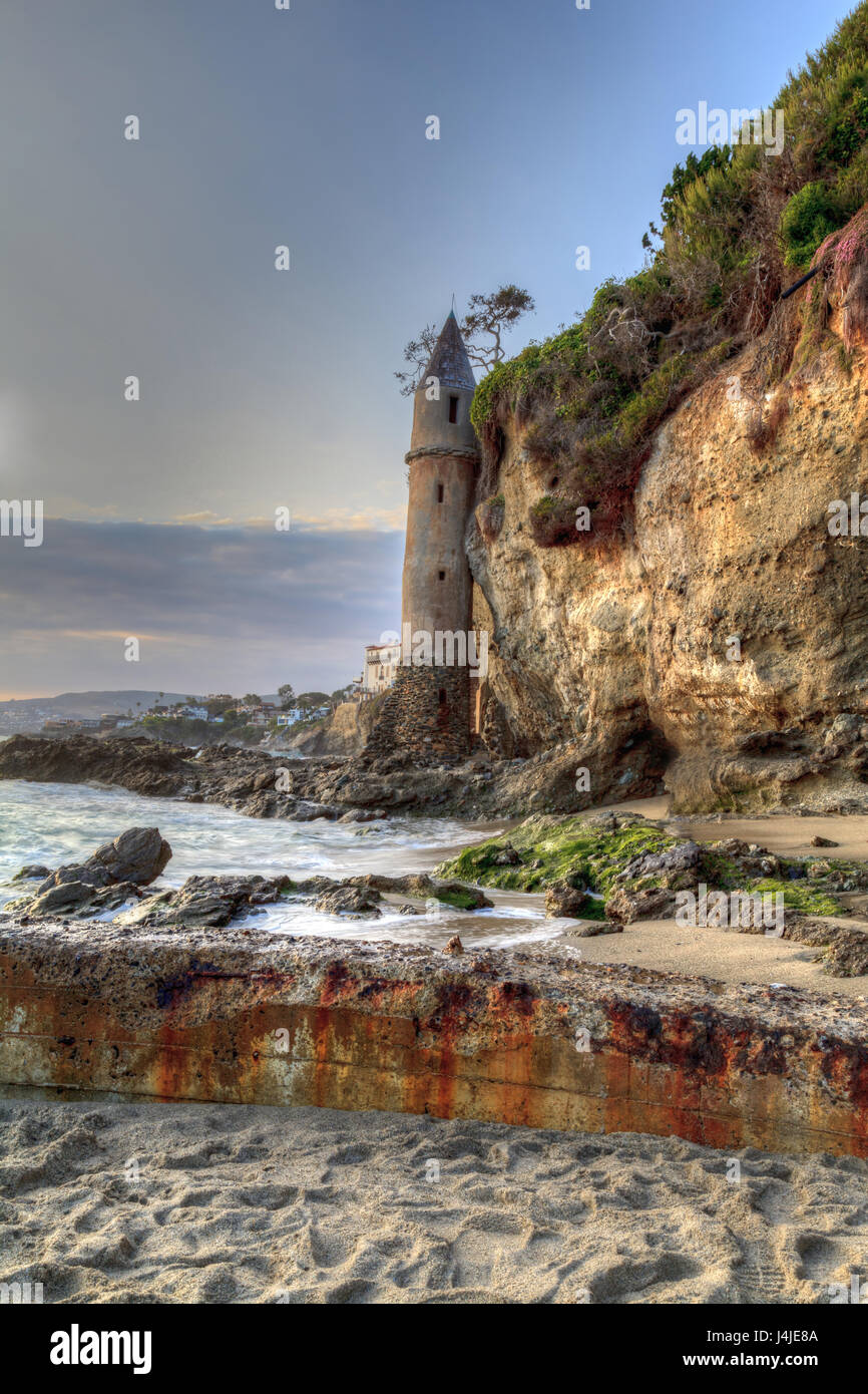 Sunset over Pirates tower at Victoria Beach in Laguna Beach, California ...