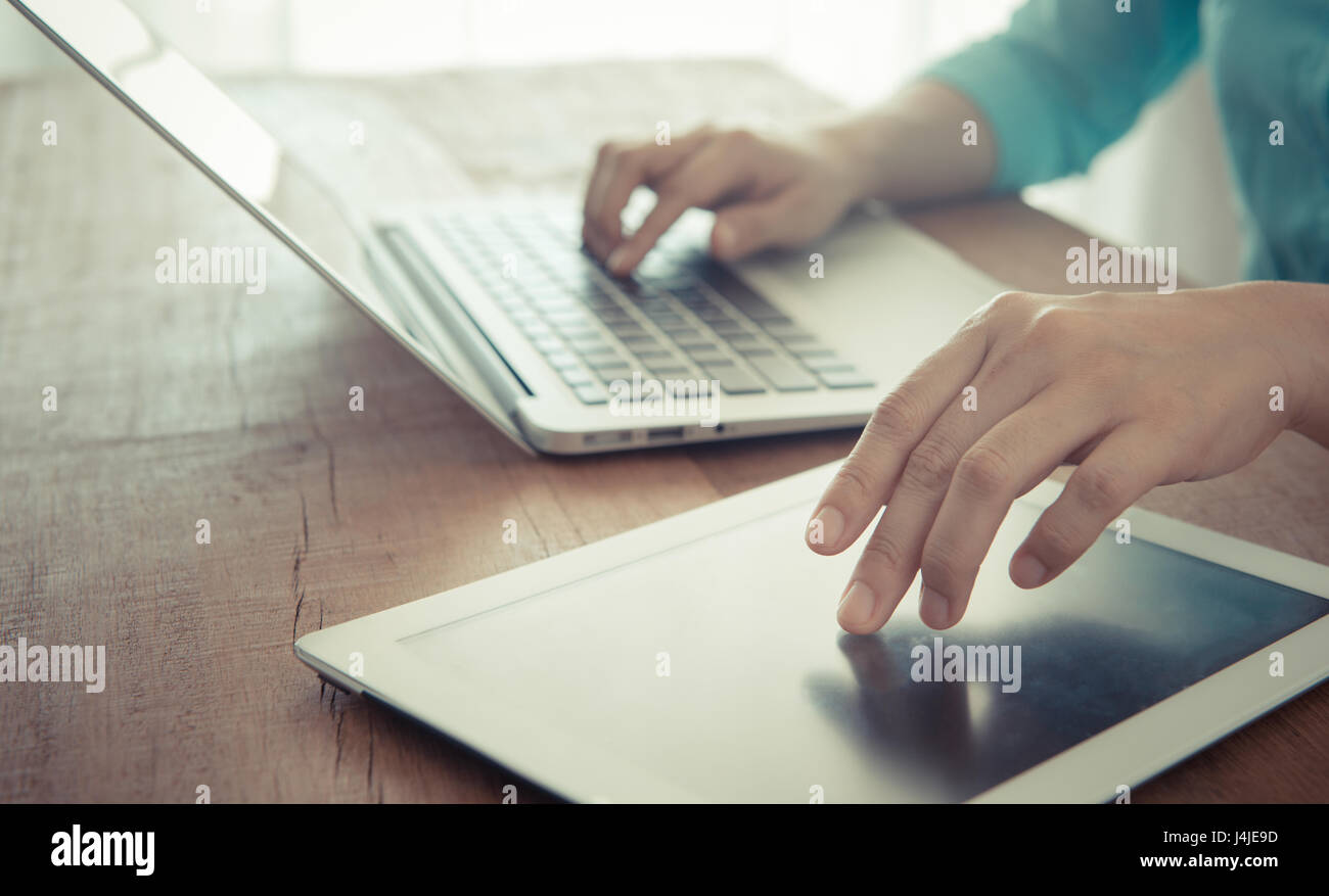 closeup a hand touch-screen tablet computer. technology concept ...