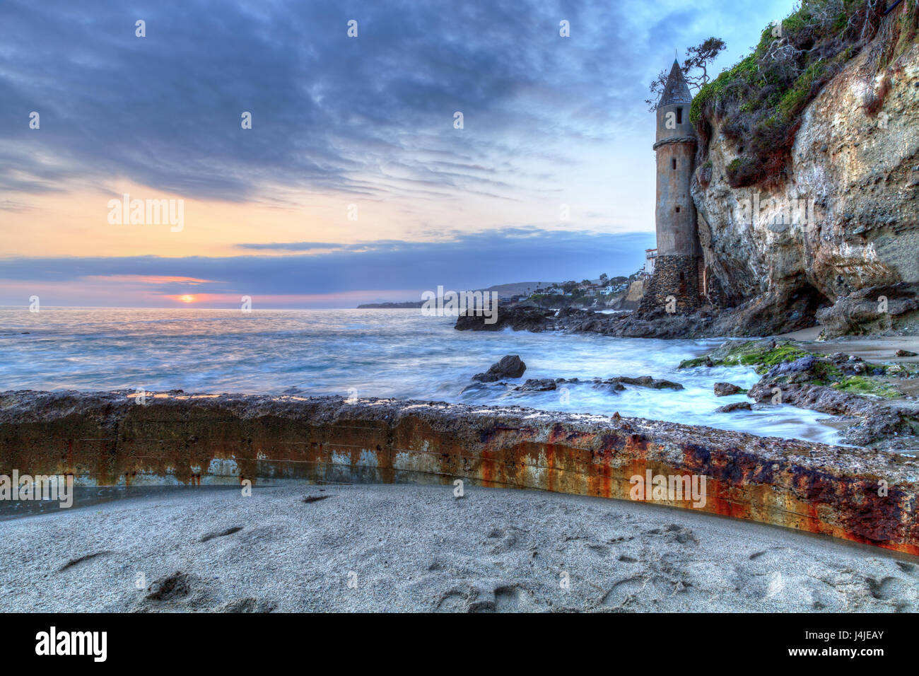 Sunset over Pirates tower at Victoria Beach in Laguna Beach, California ...