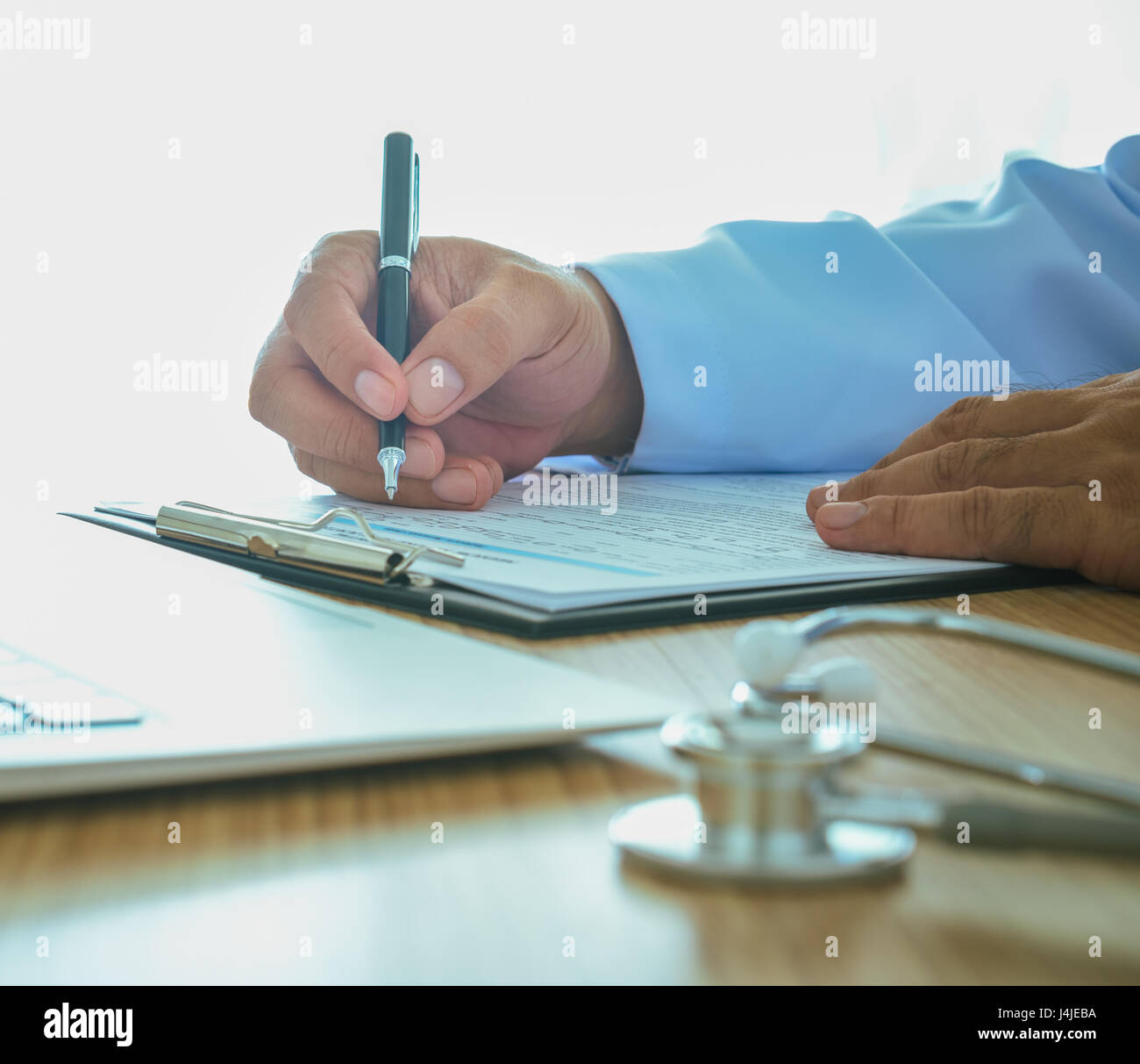 Doctors are recording information the patient's illness Stock Photo - Alamy