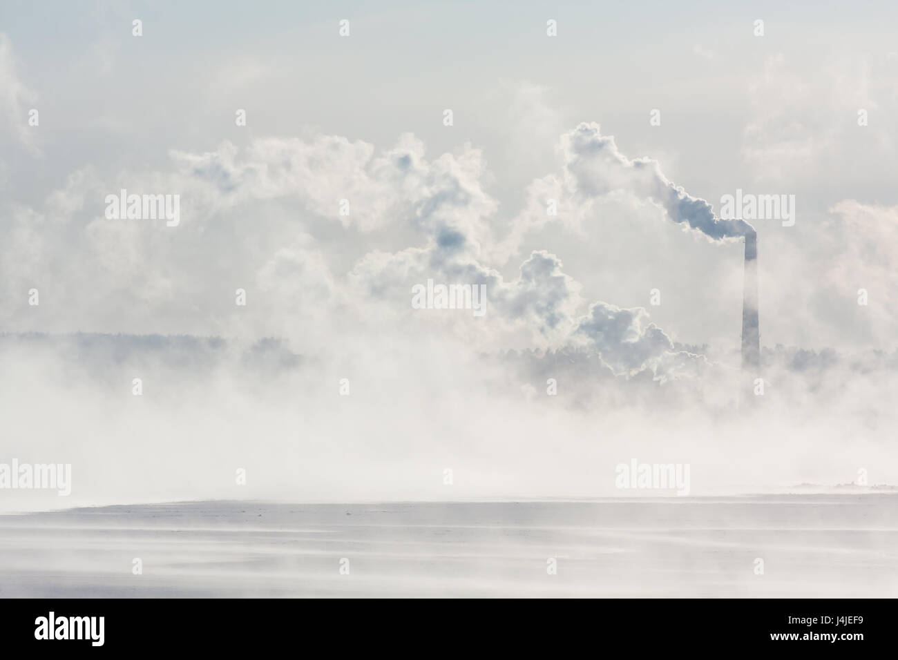 The smoke from the chimney in frost mist Stock Photo - Alamy