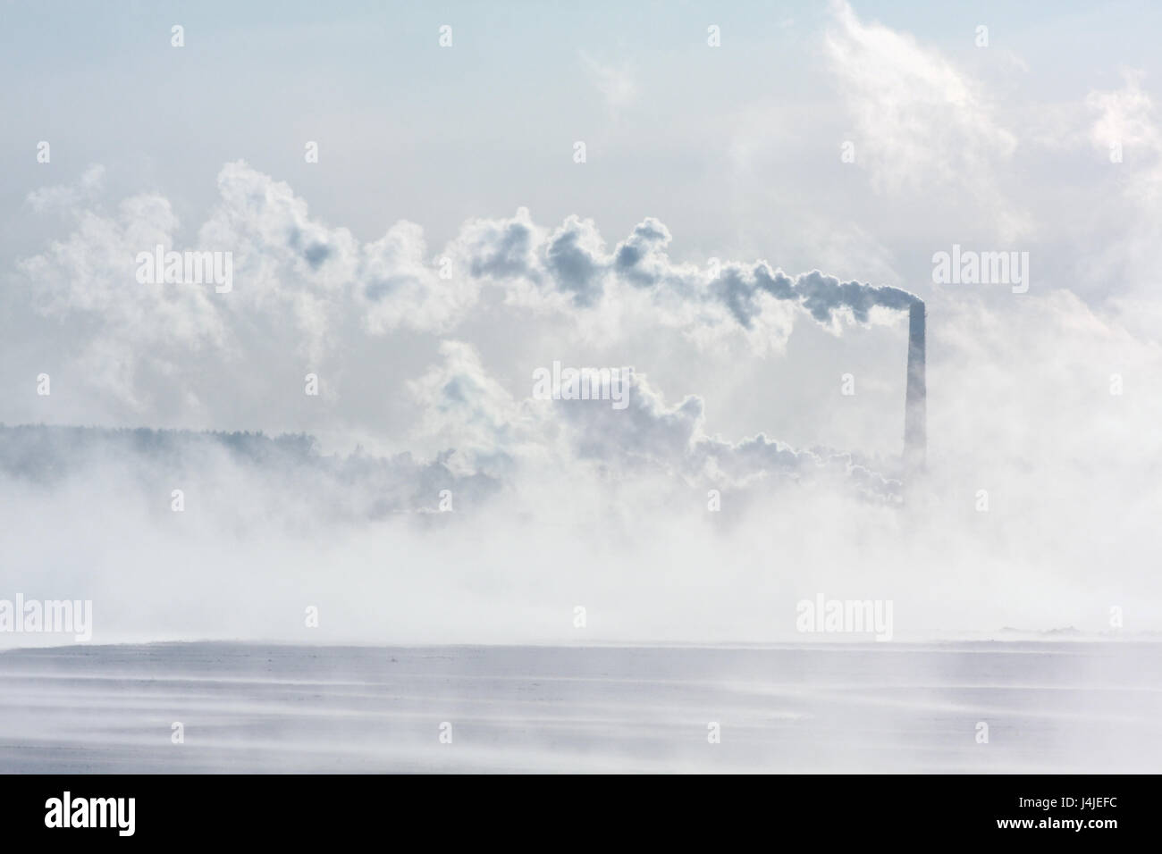 The smoke from the chimney in frost mist Stock Photo - Alamy