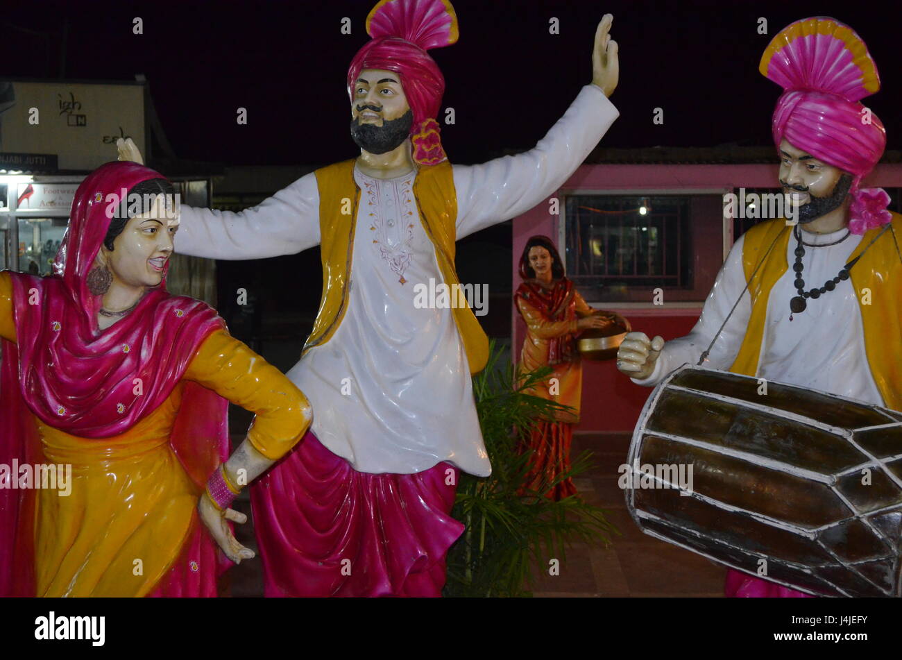 Dancing statue of Punjabi man and woman Stock Photo - Alamy
