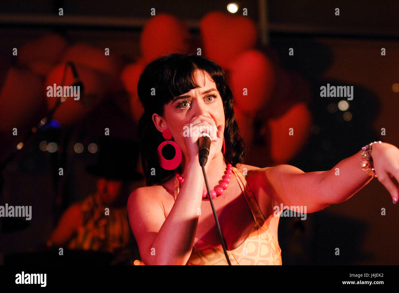 Singer Katy Perry performing at her CD release party for One Of The ...