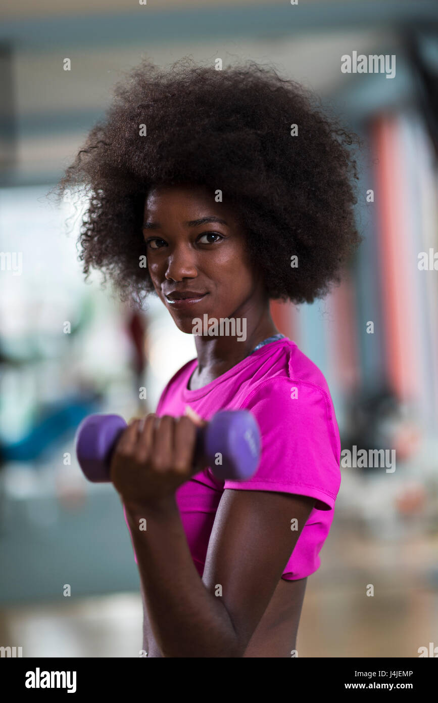 happy healthy african american woman working out in a crossfit gym on ...