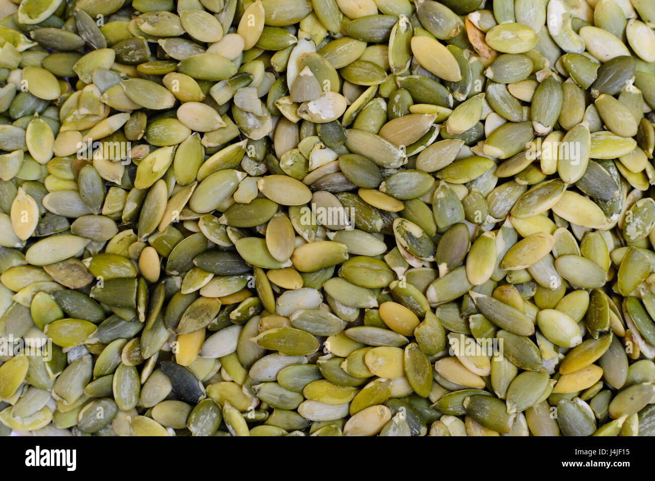 Pumpkin seeds texture photo Stock Photo - Alamy
