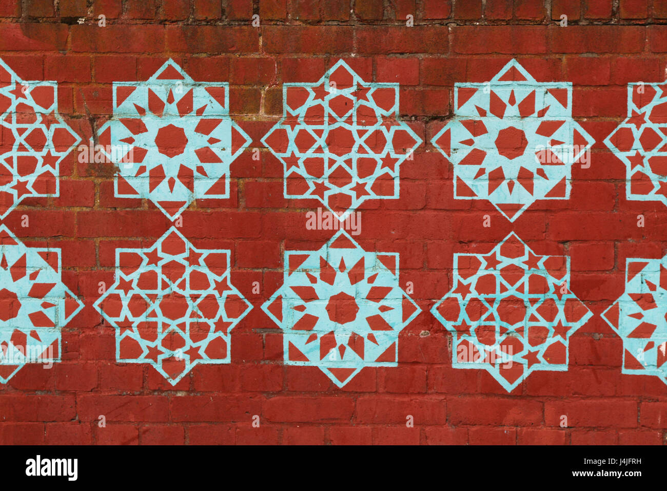 Red brick wall with graffiti pattern Stock Photo - Alamy