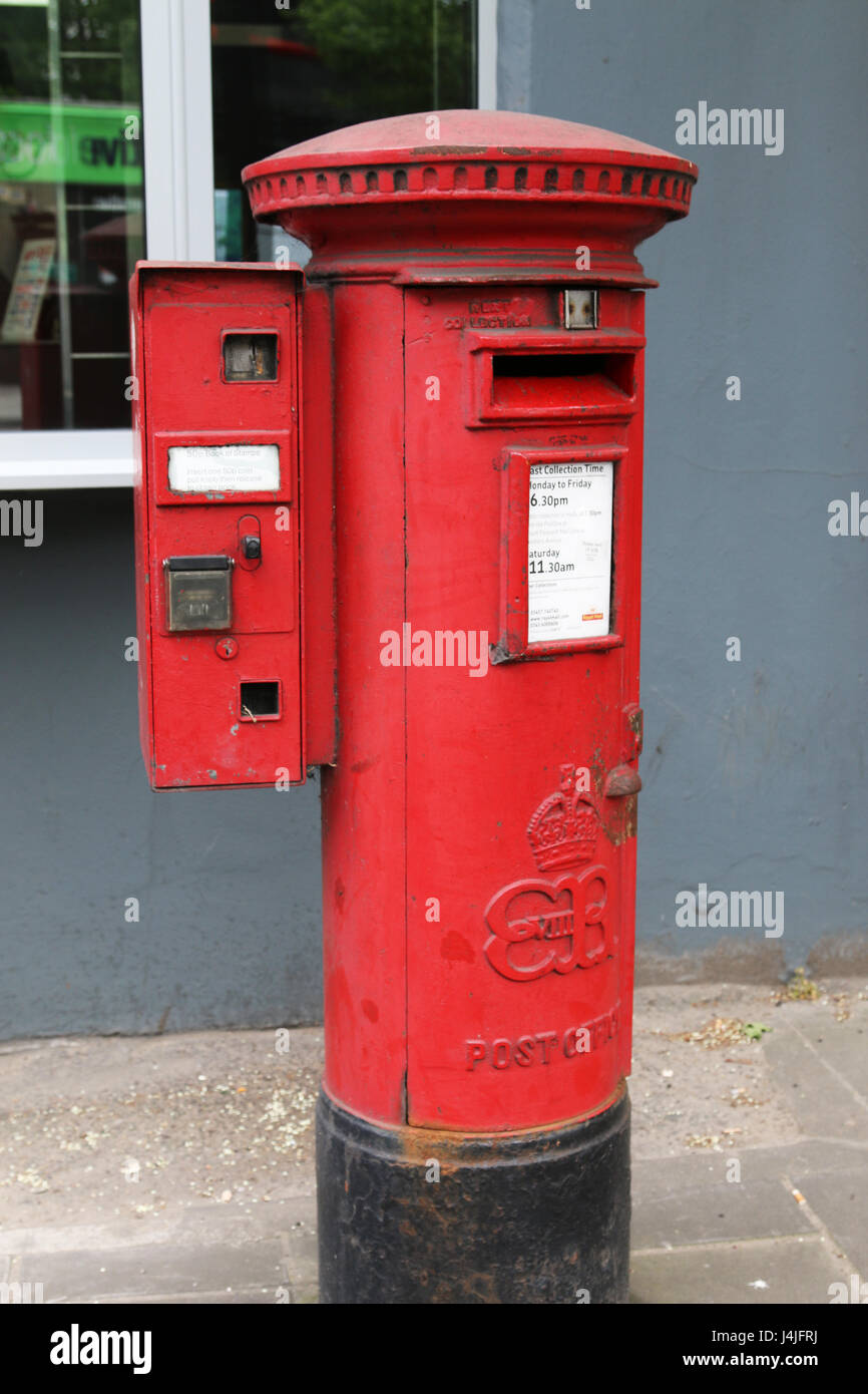 Red postbox on street Stock Photo - Alamy