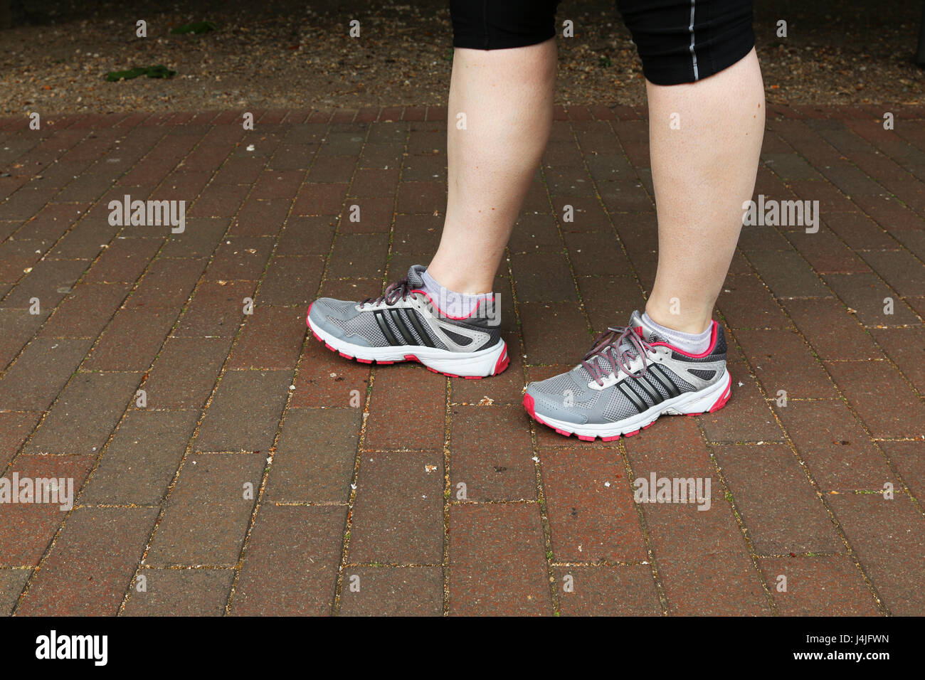 Feet in running shoes/trainers Stock Photo - Alamy