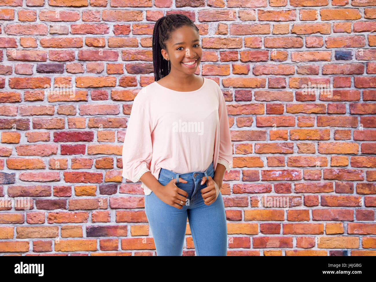 Happy african teenager girl posing Stock Photo - Alamy