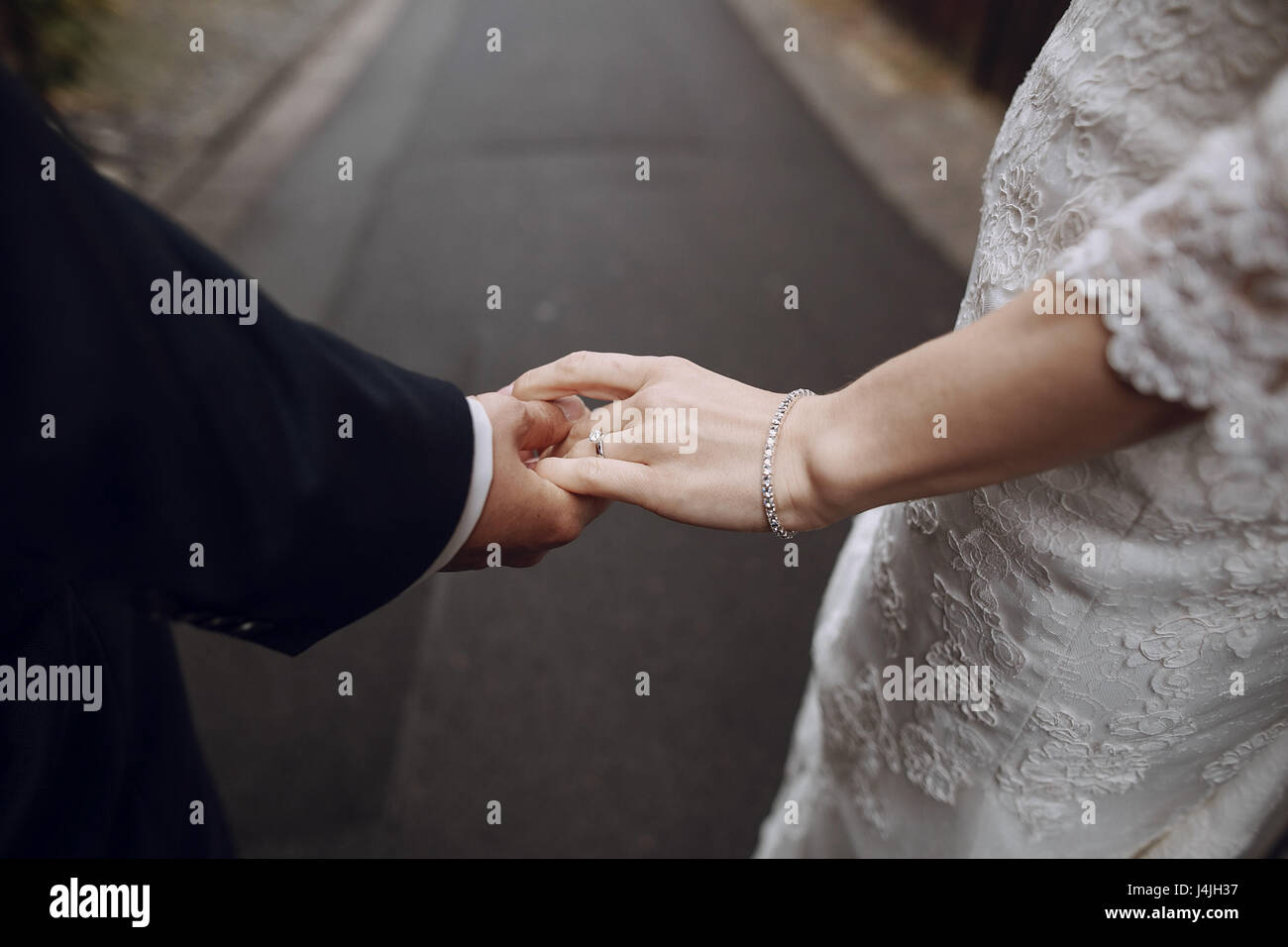 happy bride holding hands Stock Photo - Alamy