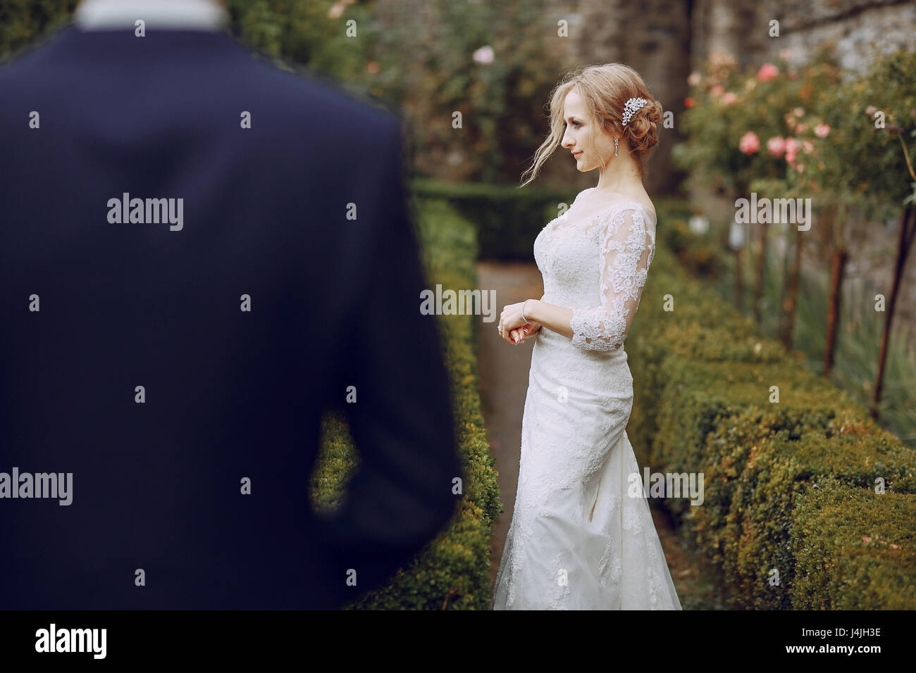 bride walking in the garden Stock Photo - Alamy