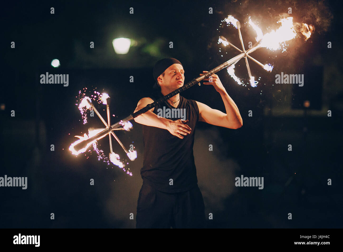 man doing tricks with fire Stock Photo - Alamy
