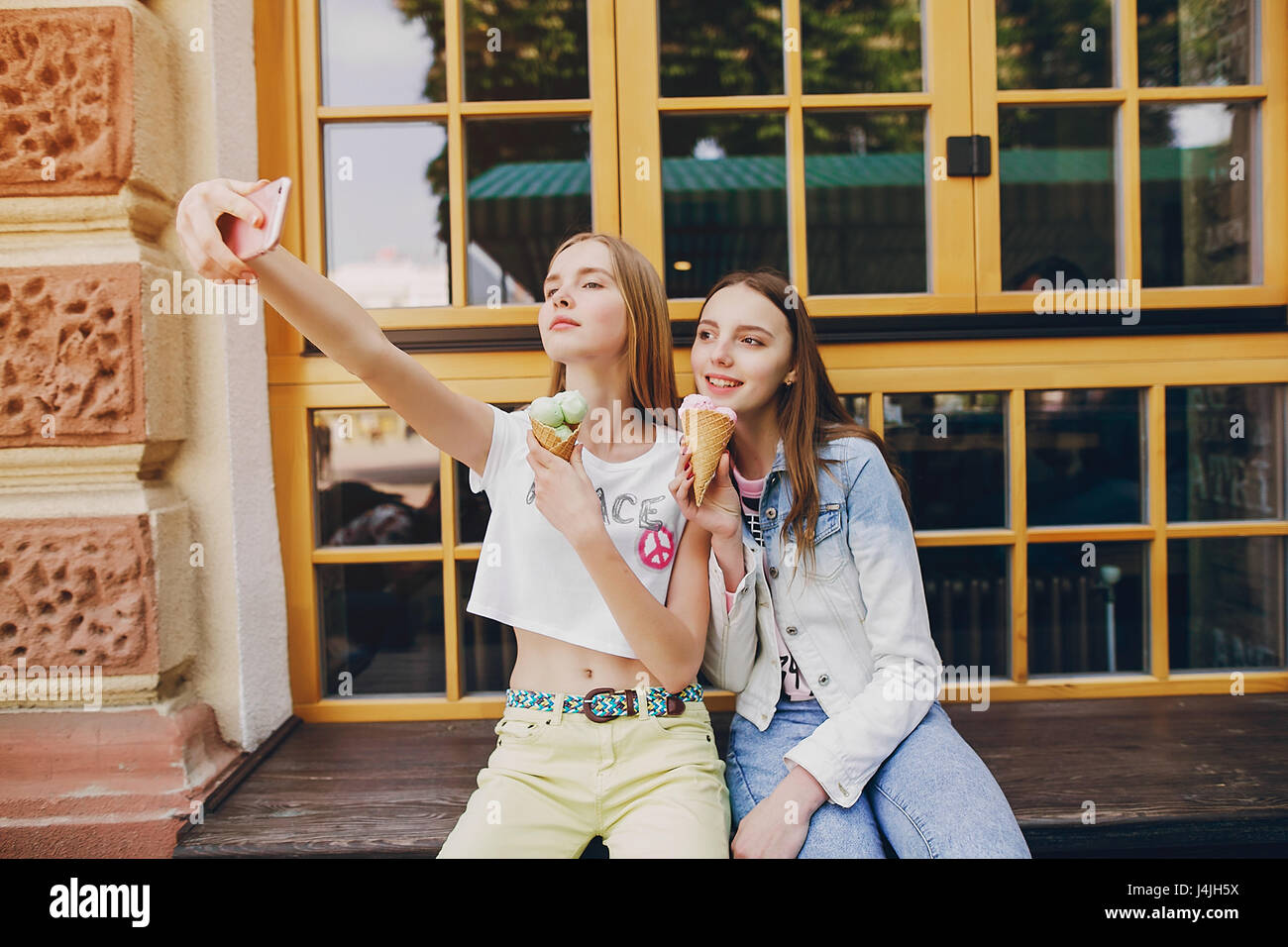 beautiful models pose for a photo in trendy clothes Stock Photo - Alamy