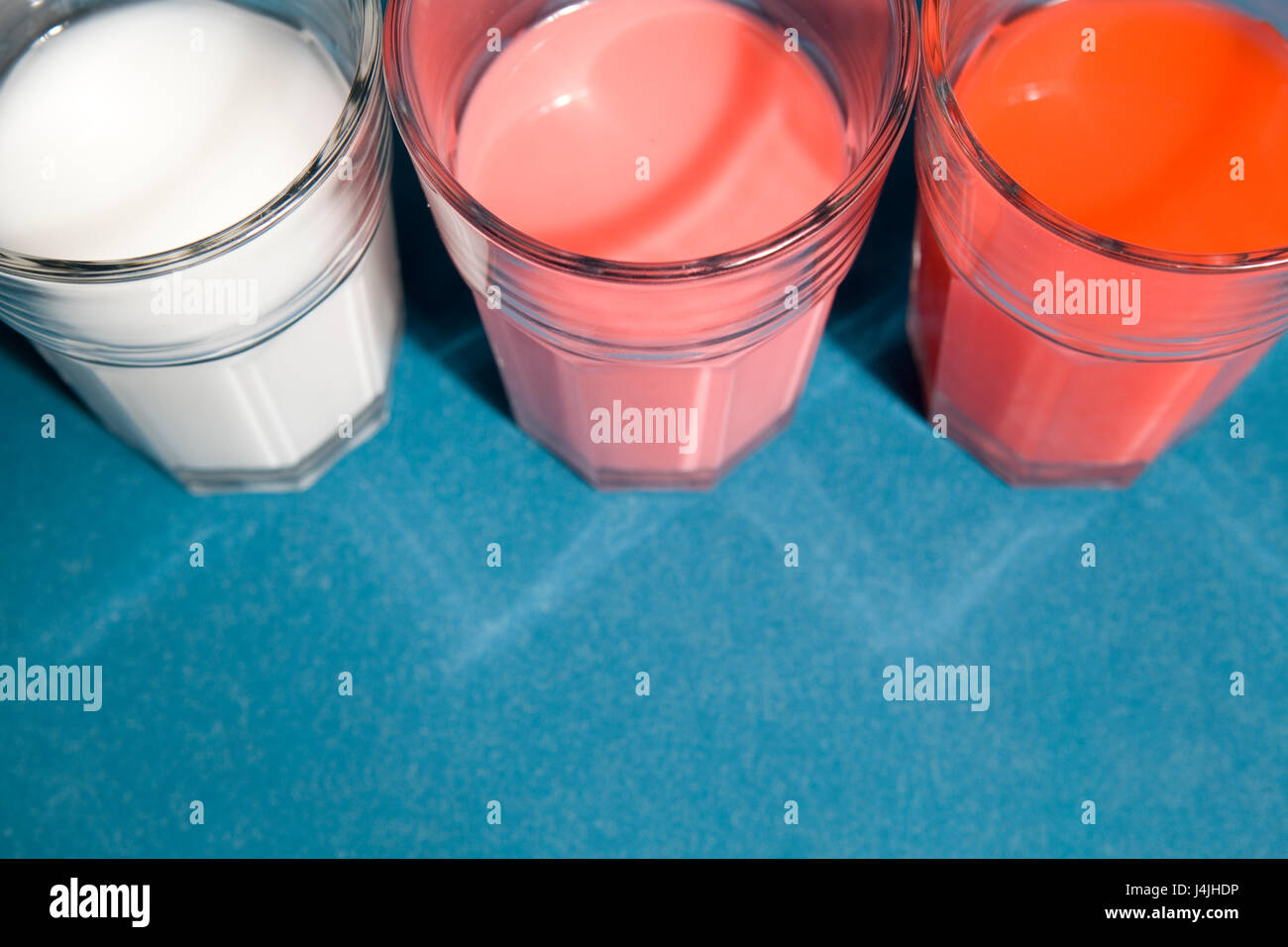set of gradient cocktail in beer glasses on a blue background Stock ...
