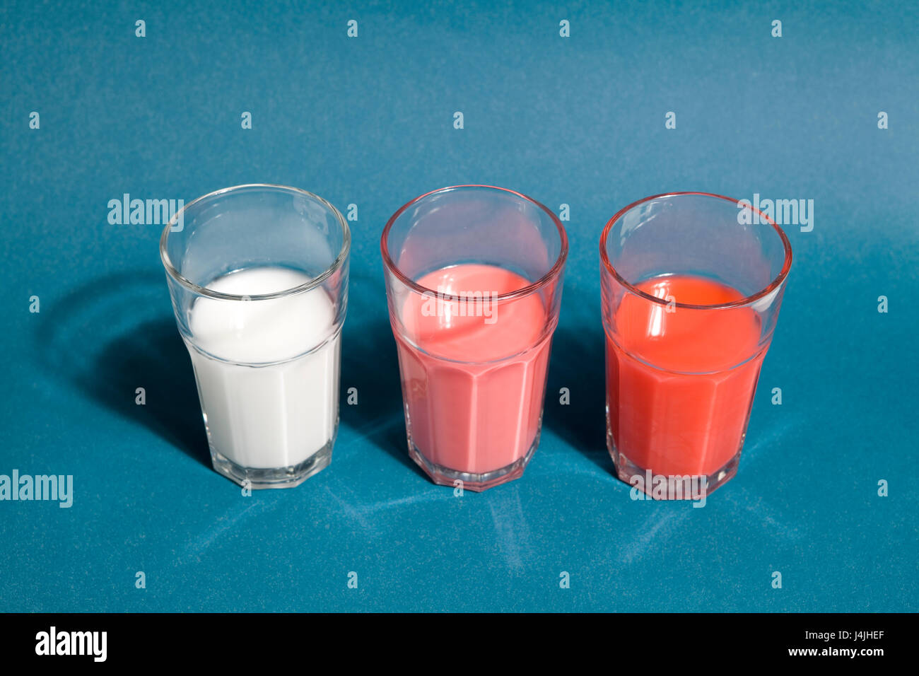 set of gradient cocktail in beer glasses on a blue background Stock ...