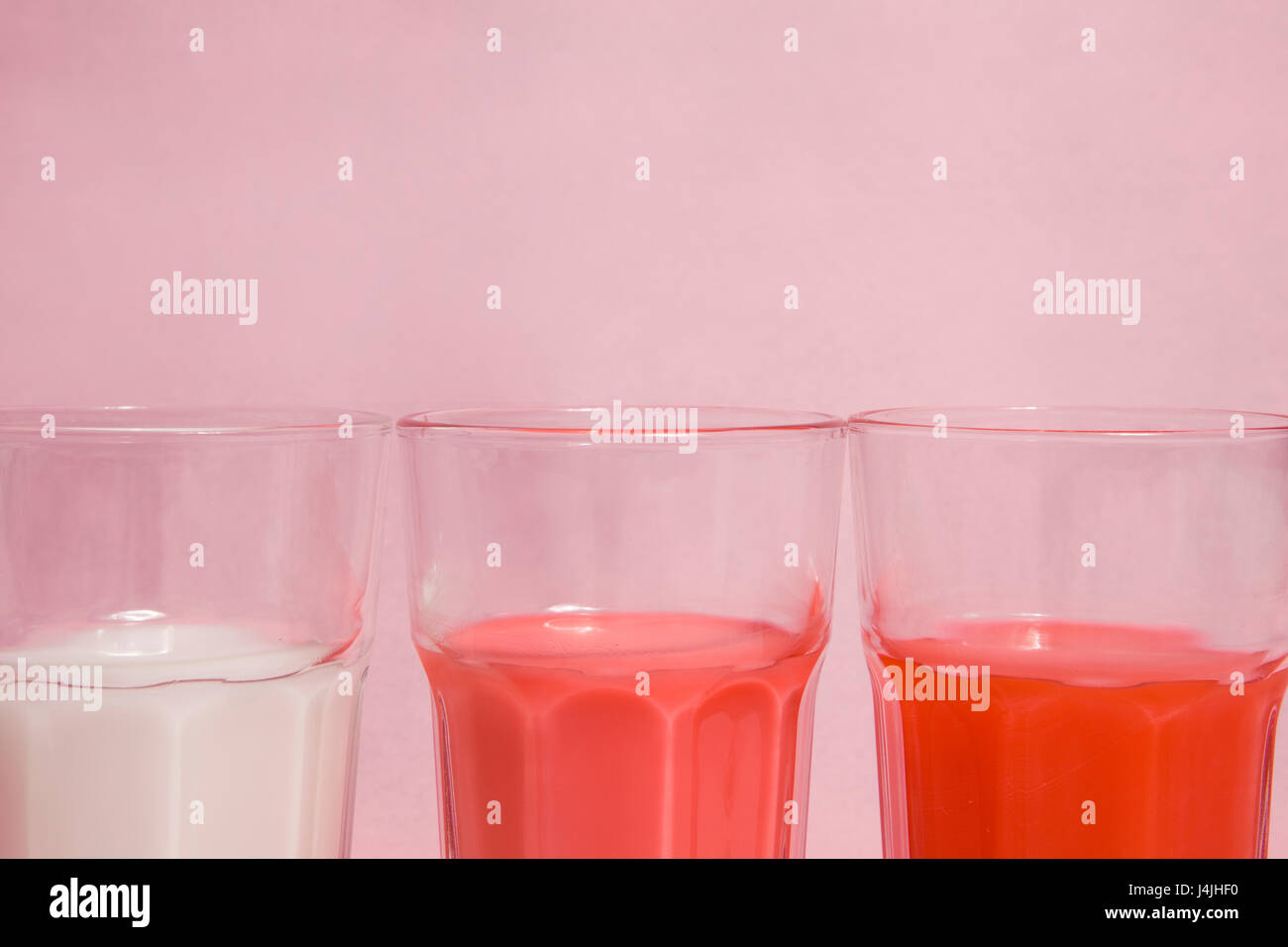 set of gradient cocktail in beer glasses on a pink background Stock ...