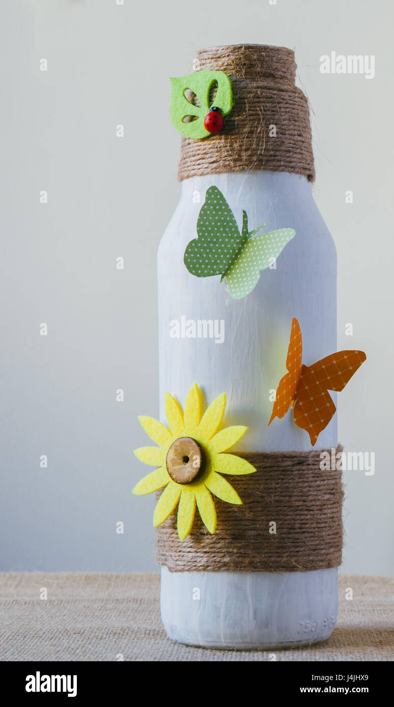 handmade decorated color glass bottle with string Stock Photo - Alamy