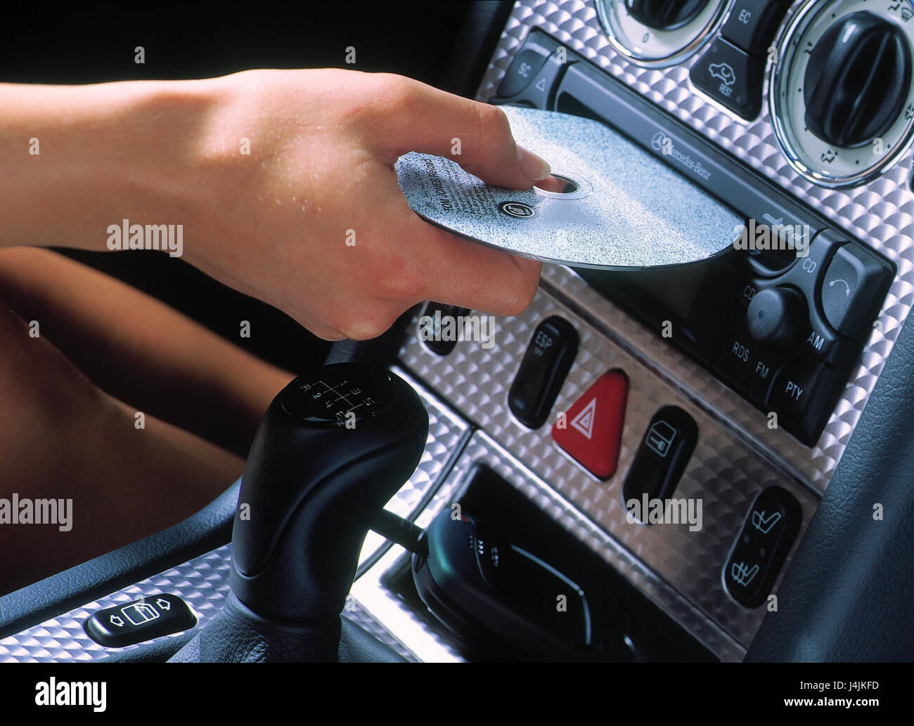 Driver, detail, hand, CD player, CD, insert car, passenger car, woman ...