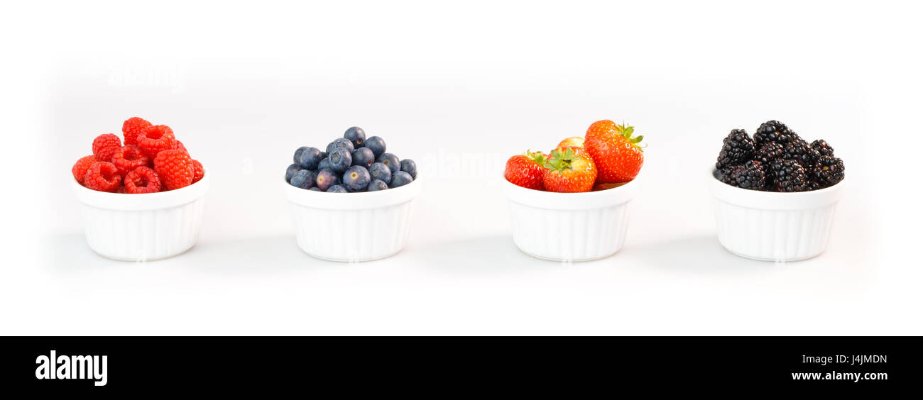 Raspberries, blueberries, strawberries and blackberries in a row ...