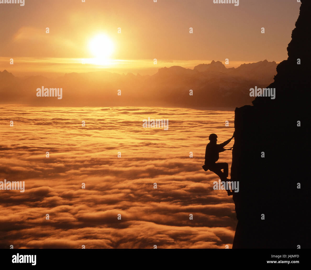 Austria, Vorarlberg, Dornbirn, cloud cover, rock, climbers, sundown [M ...