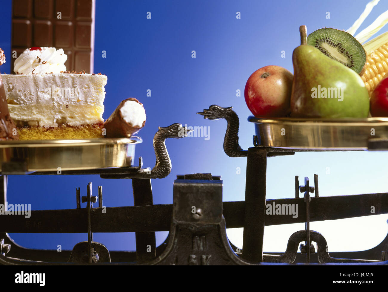 Scales, scale pans, nutrition, fruit, sweets, healthy, unhealthily food ...