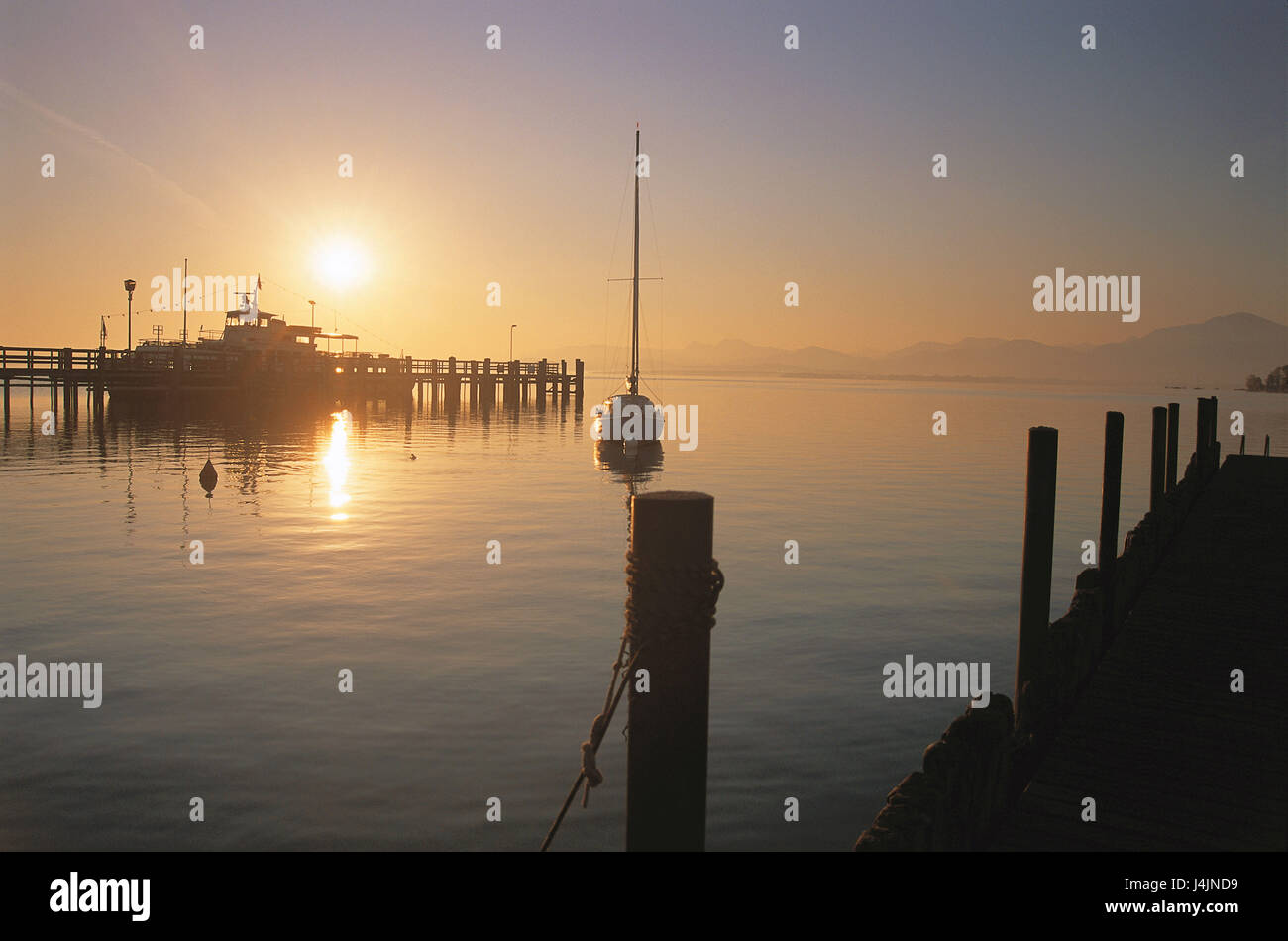 Germany, Upper Bavaria, Lake Chiem, Gstadt, bridge, silhouette, sunrise ...