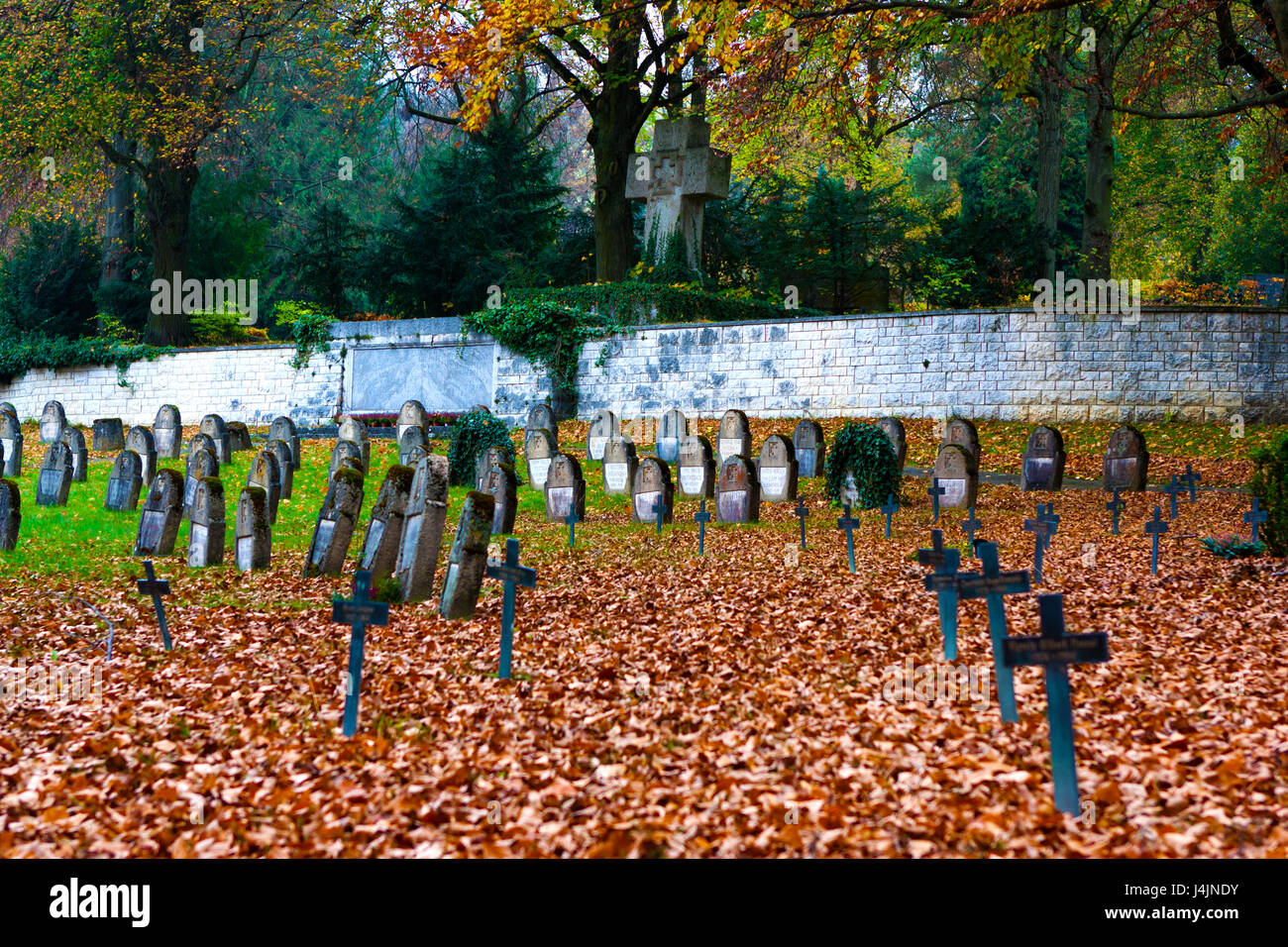 ULM, GERMANY – NOVEMBER 1, 2013: Crosses and tombstones in autumn ...