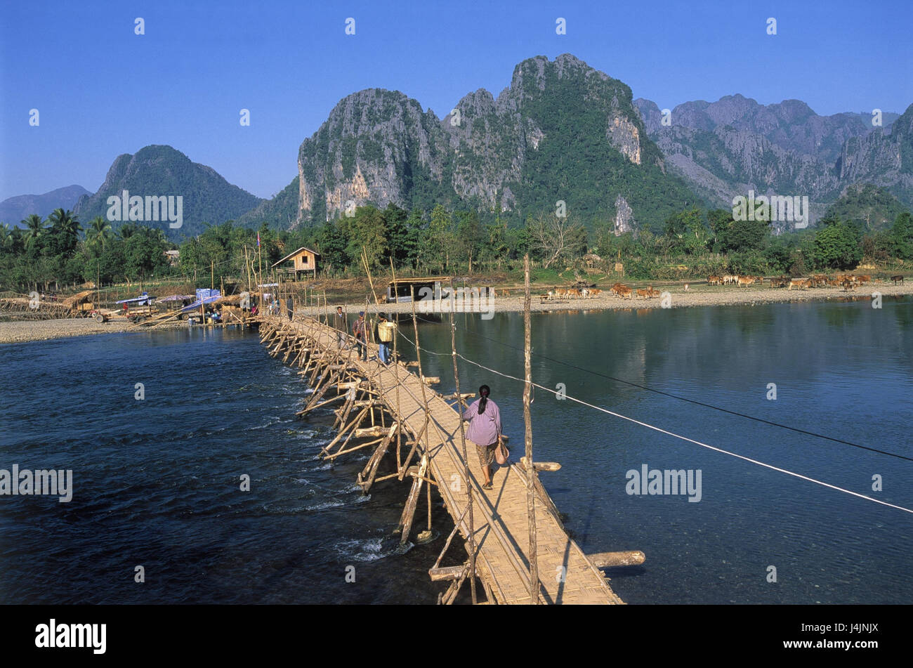 Laos, Vang Vieng, village, Nam Song, wooden bridge, person Asia ...