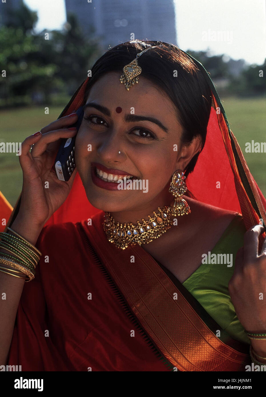 India, woman, young, smile, sari, mobile phone, call up, portrait Asia ...