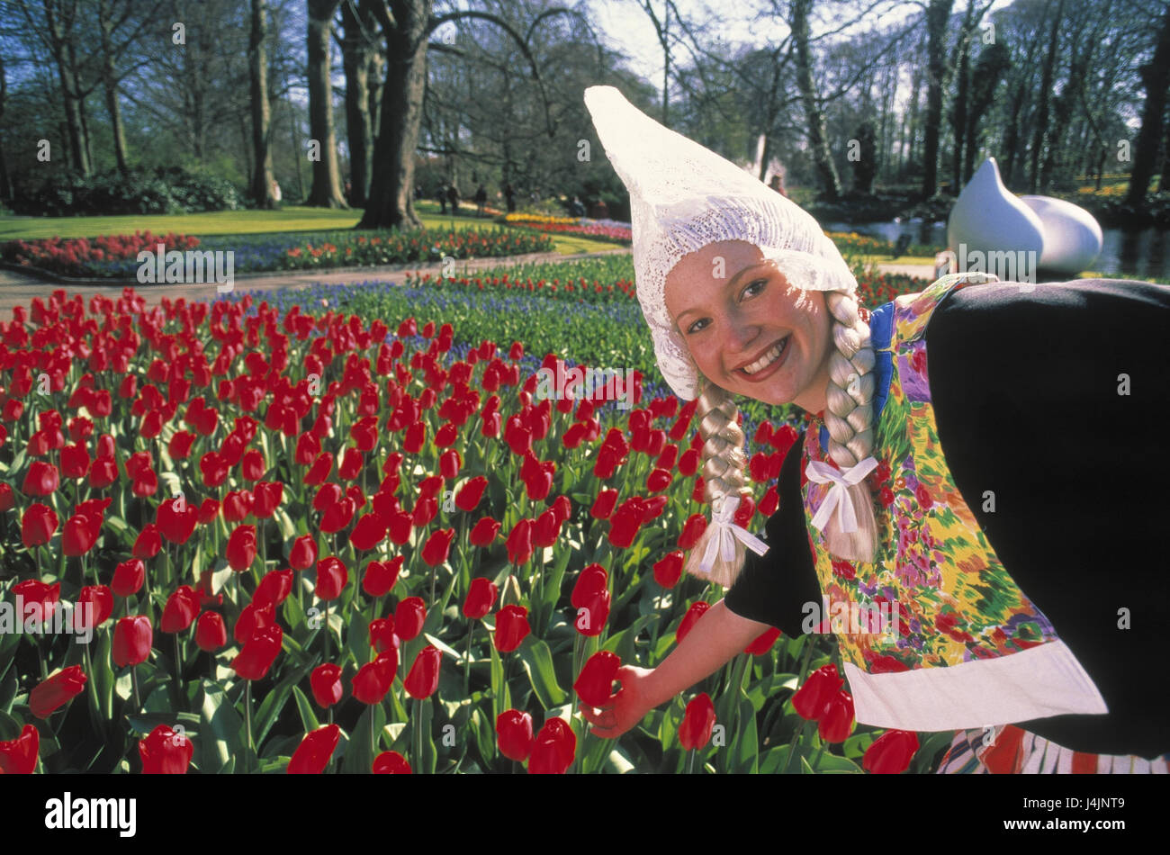 The Netherlands, Lisse, Keukenhof, flower park, woman, national costume ...