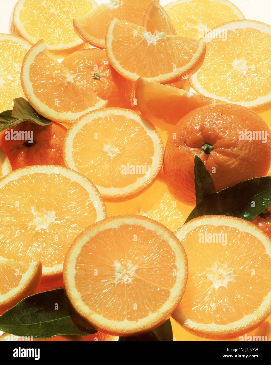 Oranges, Citrus sinensis, completely, cut open still life, fruit ...