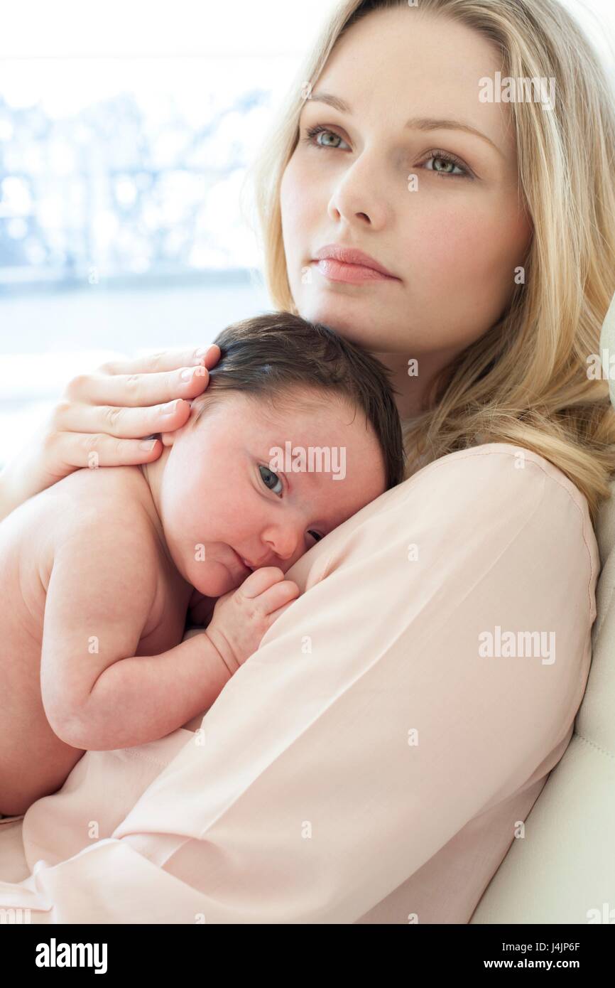Mother holding newborn baby girl Stock Photo - Alamy