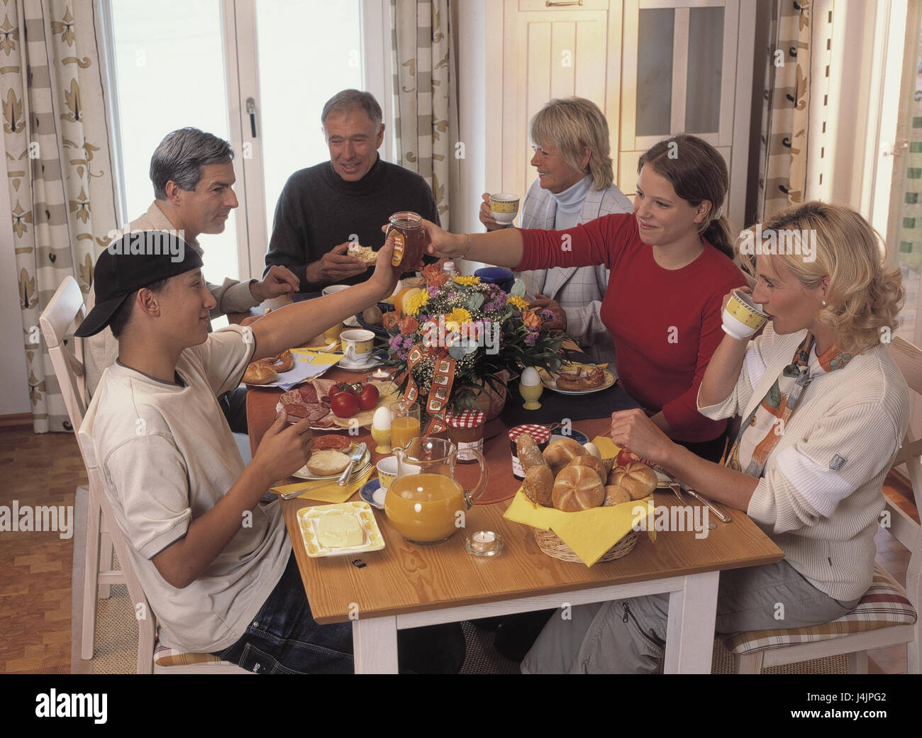 Family, friends, breakfast inside, at home, breakfast table, have ...