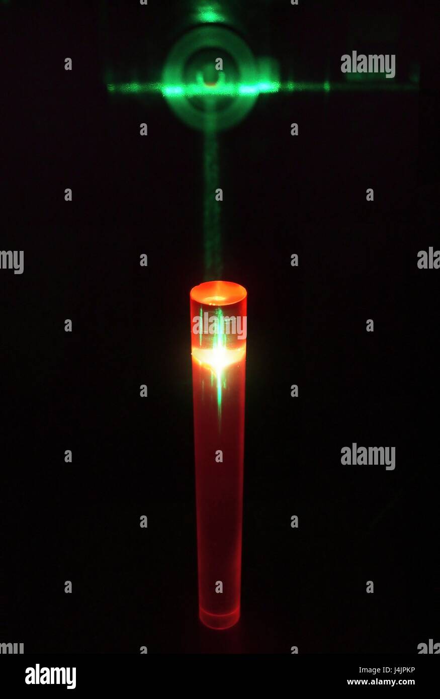 Laser and ruby rod. Experiment with a green laser beam being used to ...