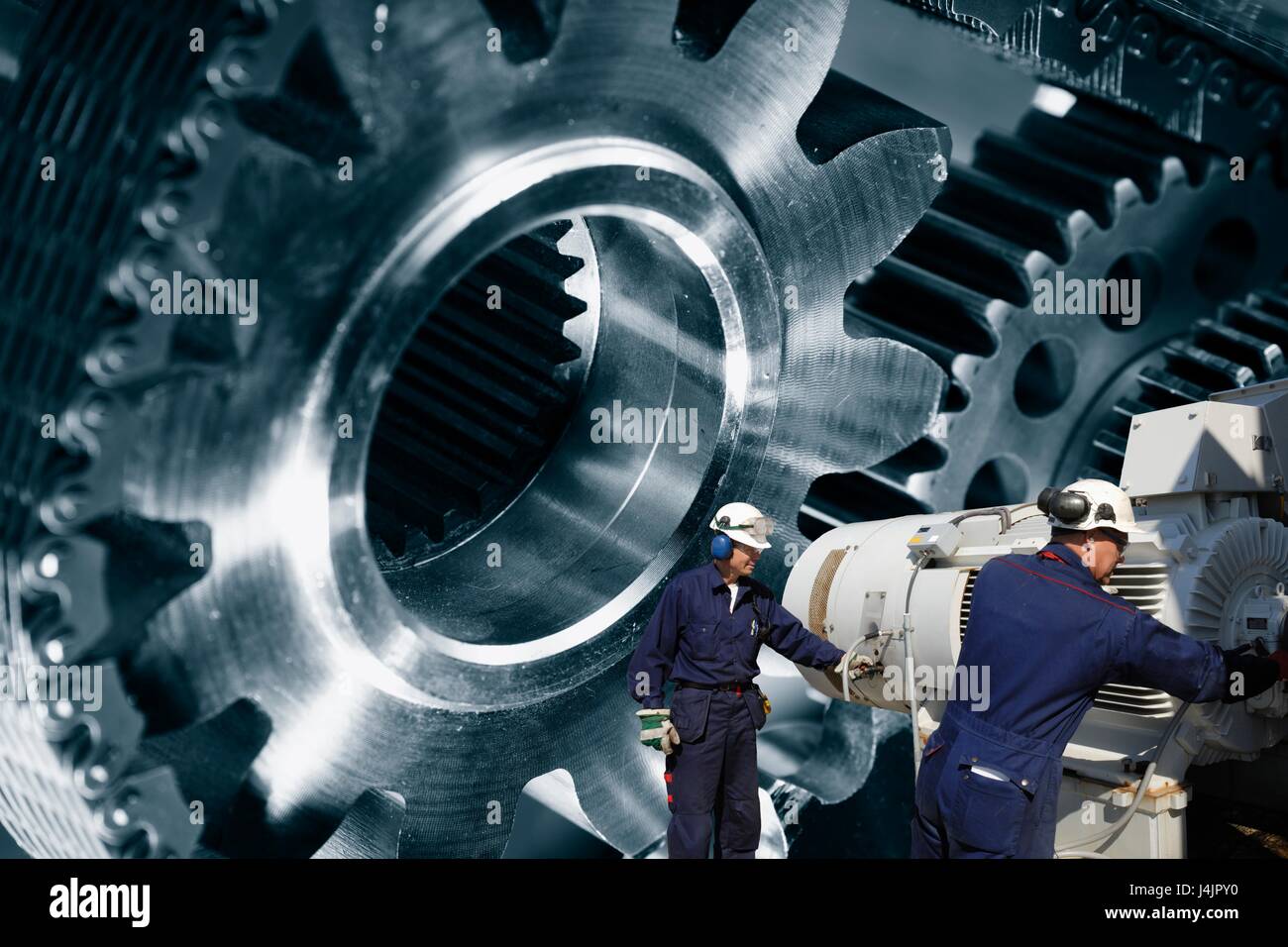 Machinery cogs with people hi-res stock photography and images - Alamy
