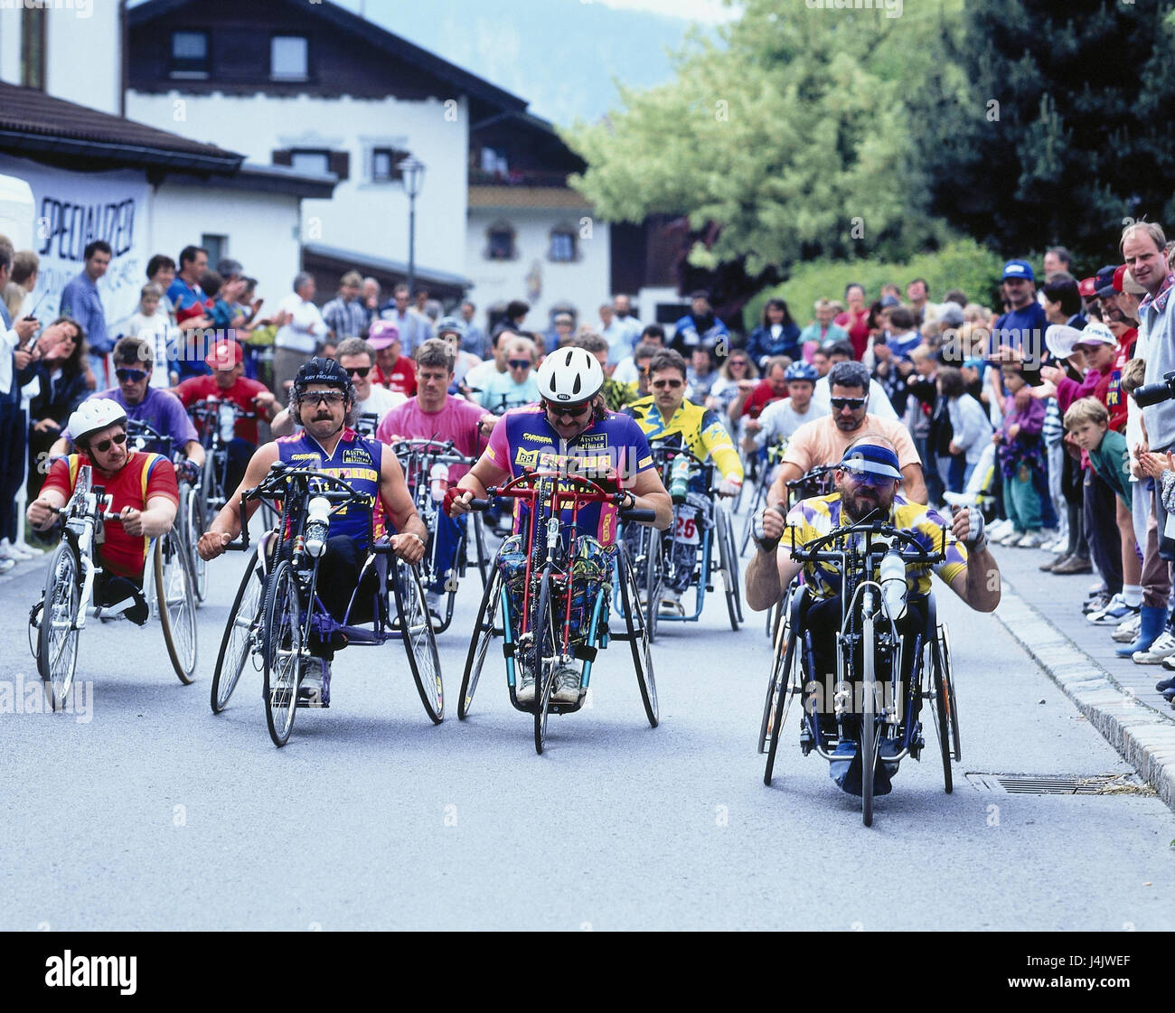 Handicapped sport, hand bike race, dimension start, spectator outside ...