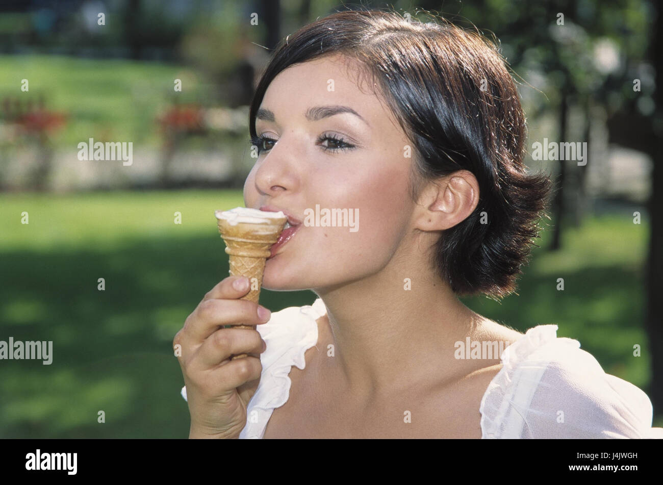 Meadow, girl, sit, eat ice cream food, portrait outside, summer ...
