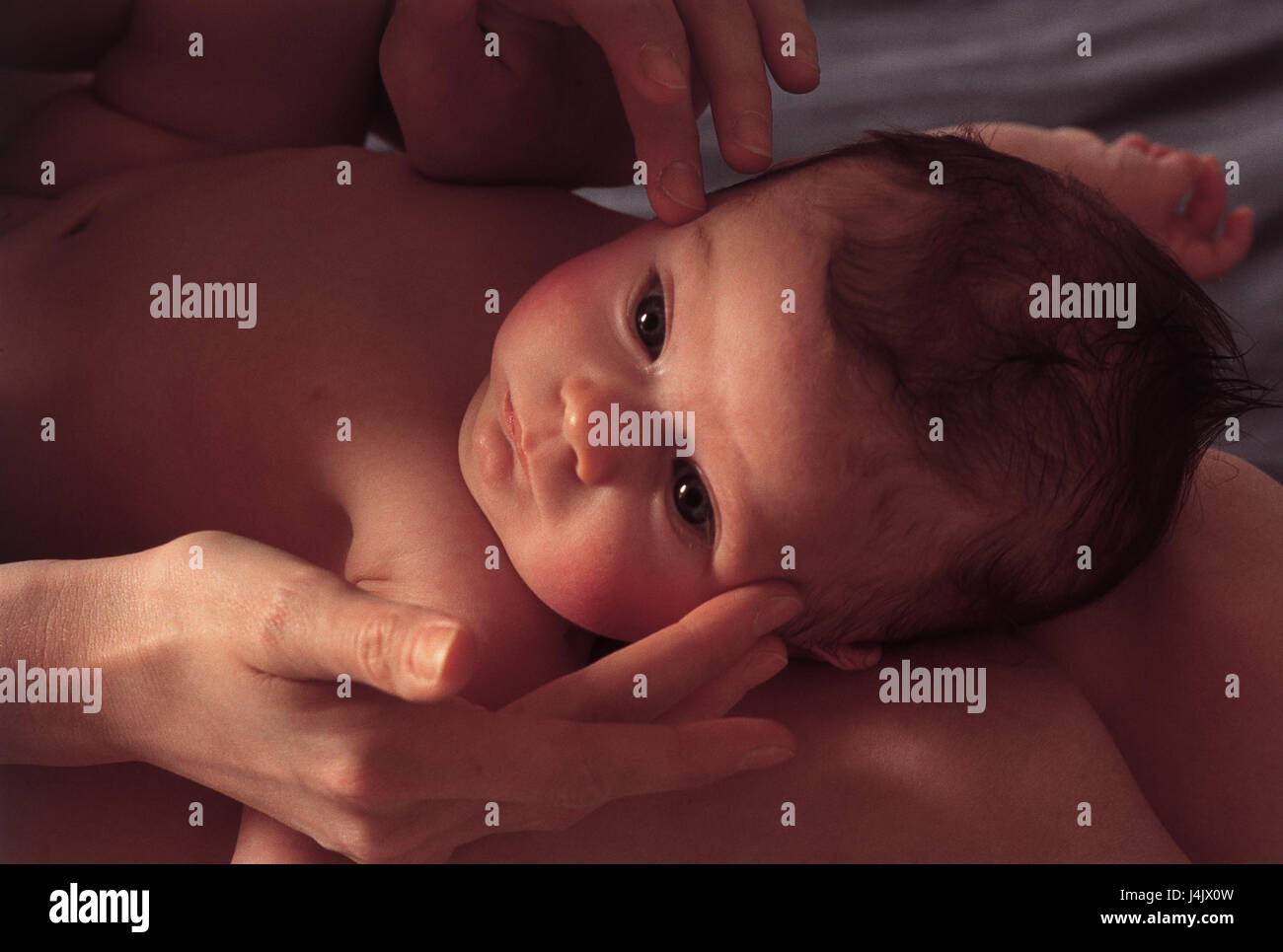 Mother, detail, hands, baby, temples, massage very closely, at home ...