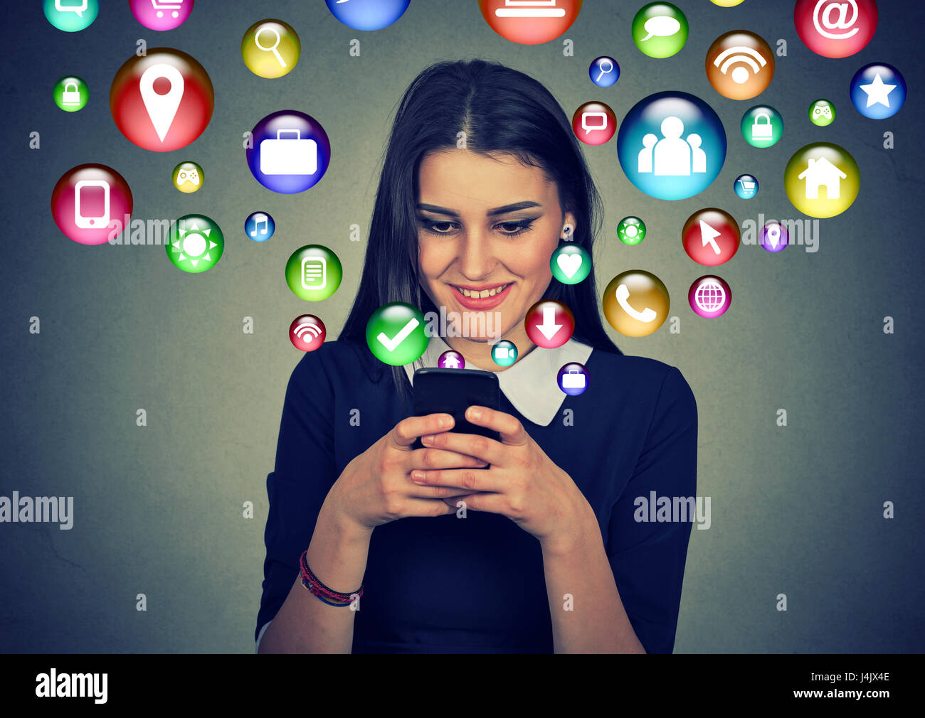 Mobile communication technology concept. Happy young woman using ...