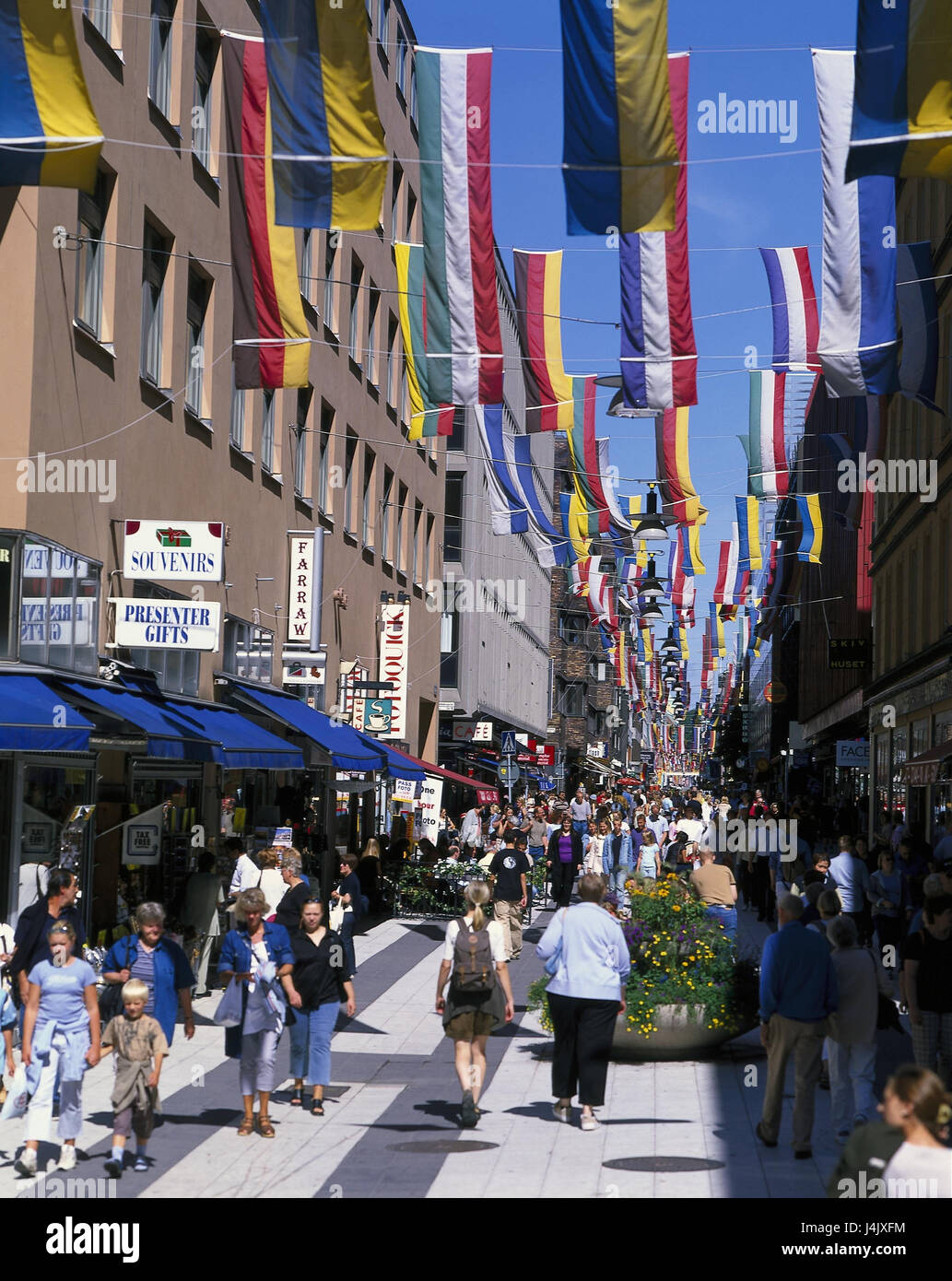 Sweden, Stockholm, Drottninggatan street, shops, passers-by outside ...