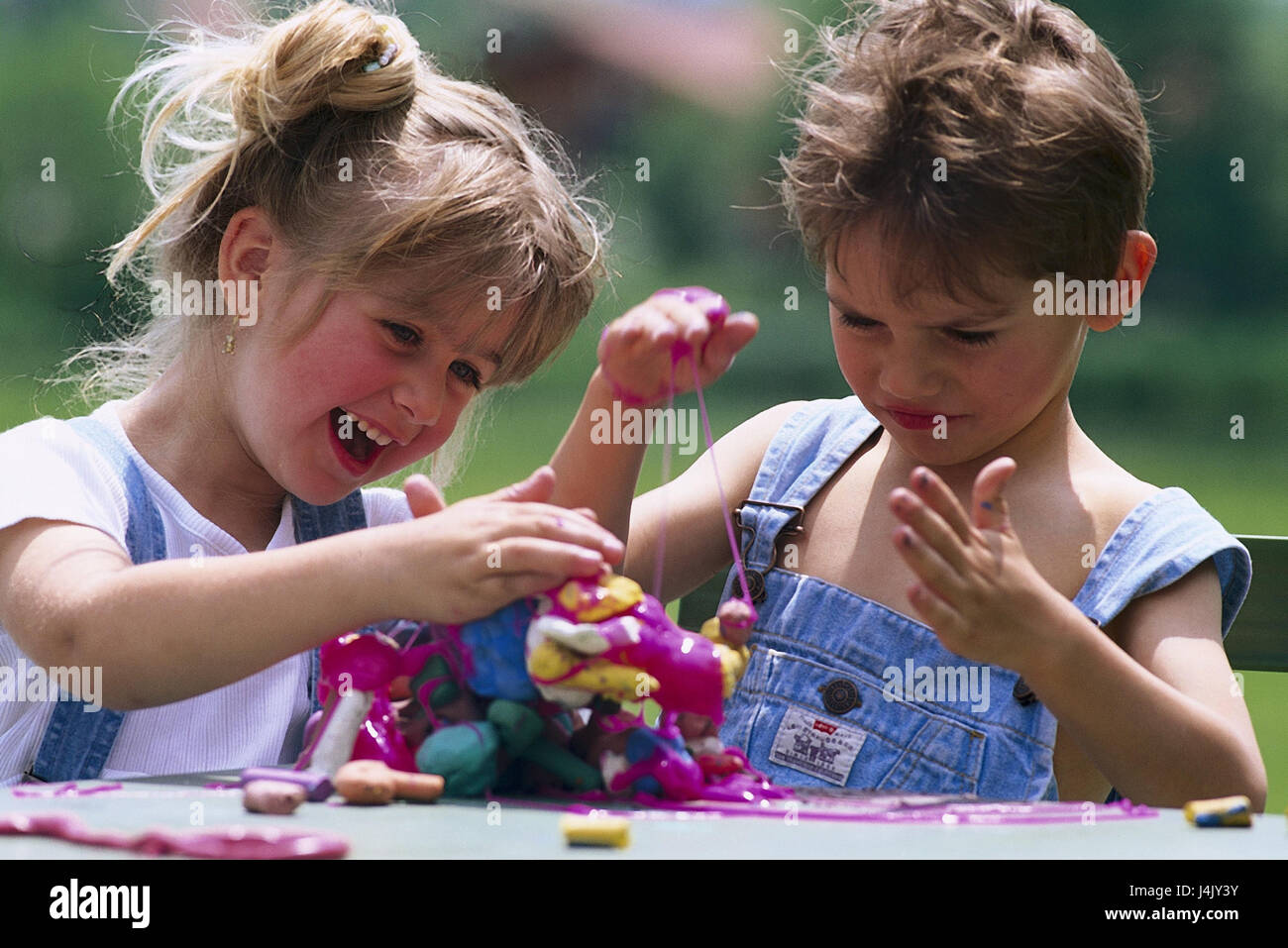 Boy, girl, happily, plasticine, play outside, summer, children ...