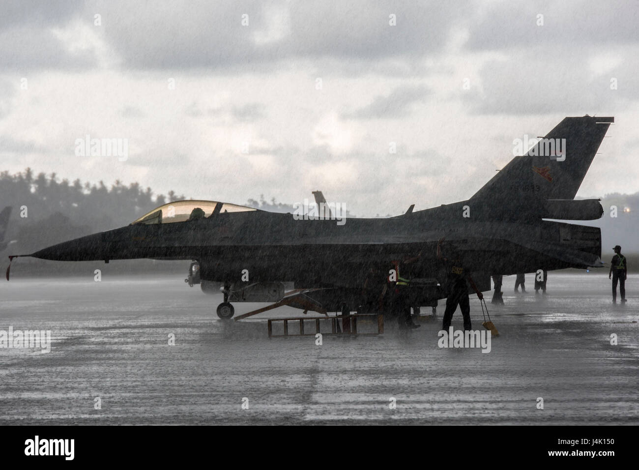 An Indonesian Air Force F-16 Fighting Falcon sits on the flight line ...