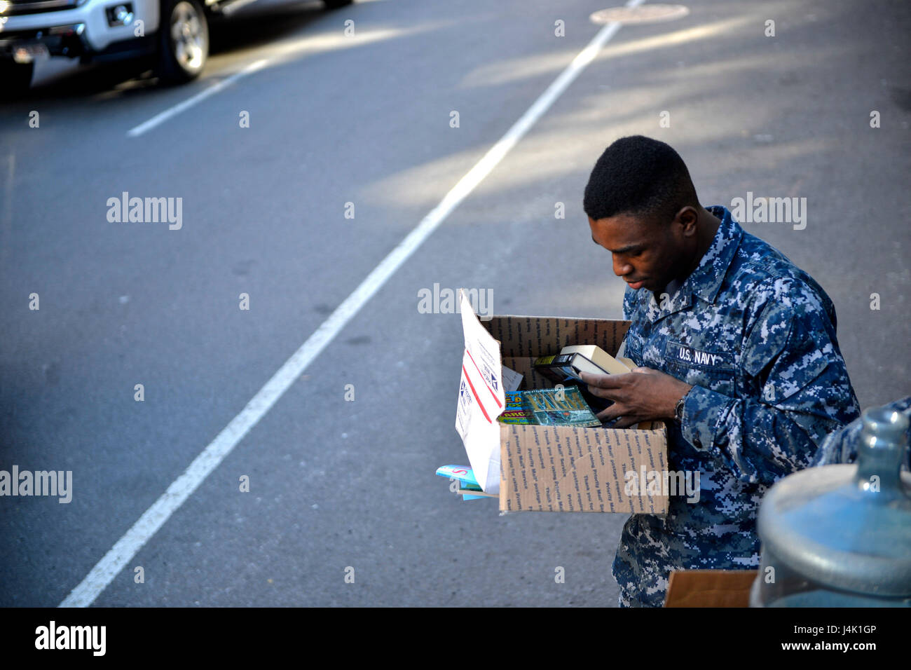 NEW YORK (Nov. 12, 2016) – Seaman Dashiva Francois helps to clean out ...
