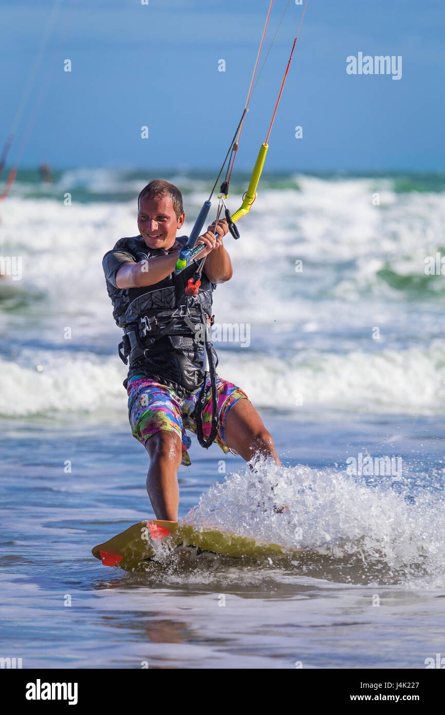 Athletic man riding on kite surf board on a sea waves Stock Photo - Alamy